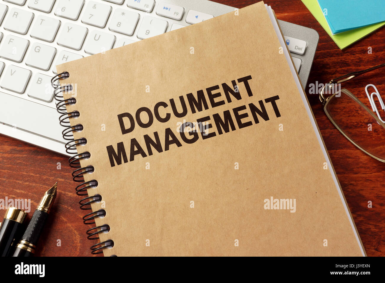 Book with title document management in an office Stock Photo - Alamy