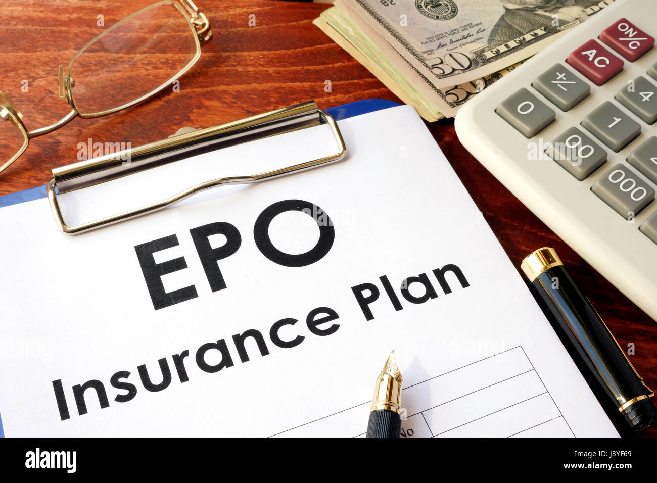 EPO Insurance Plan on a table. (Exclusive Provider Organization Stock ...