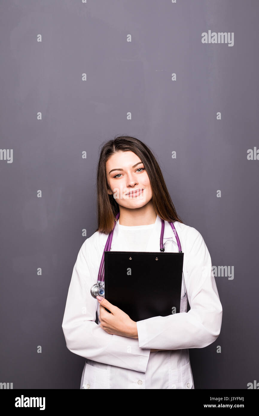 Portrait of young medical doctor with clipboard Stock Photo - Alamy
