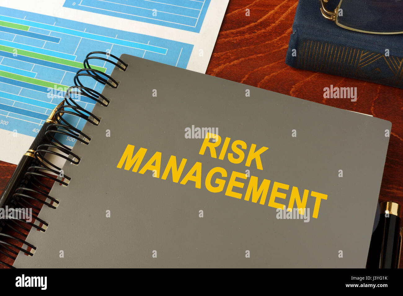 Book with title risk management in an office Stock Photo - Alamy