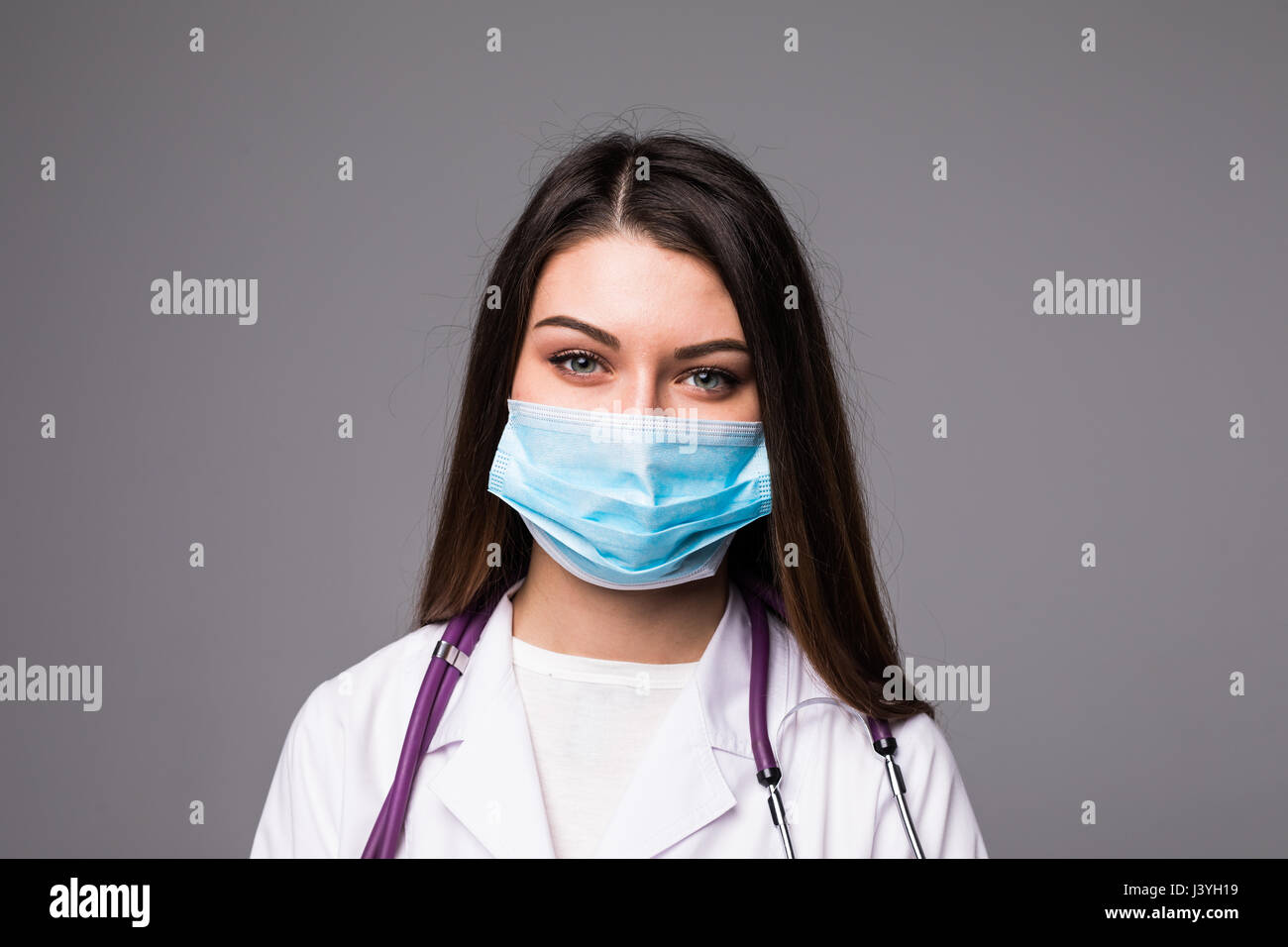 Young woman doctor or nurse in cap and face mask Stock Photo - Alamy