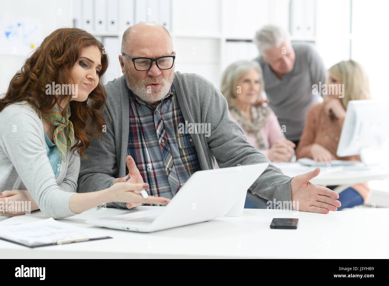 Team of businessmen working together Stock Photo - Alamy