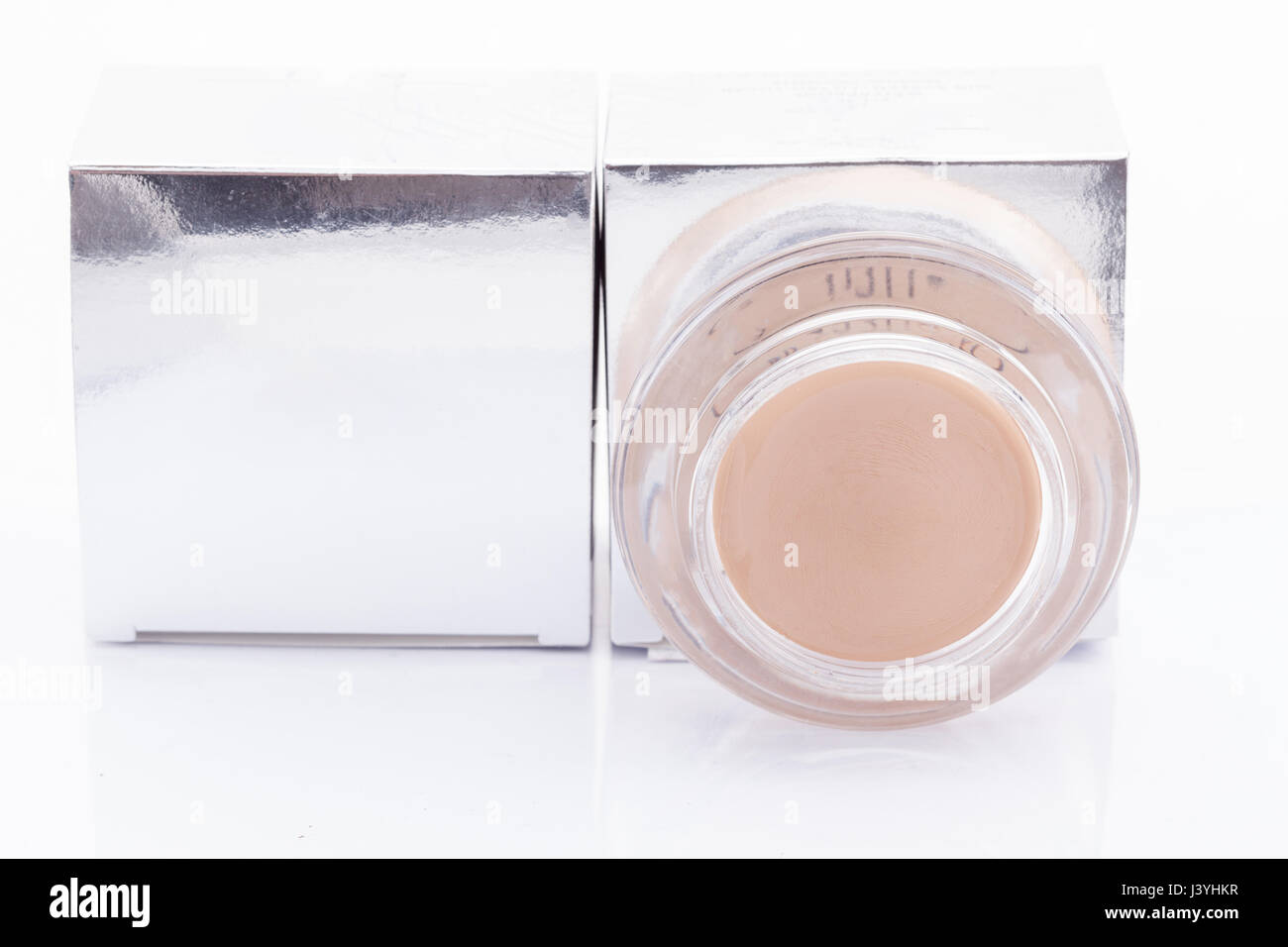Cosmetic products isolated over white background in studio photo ...