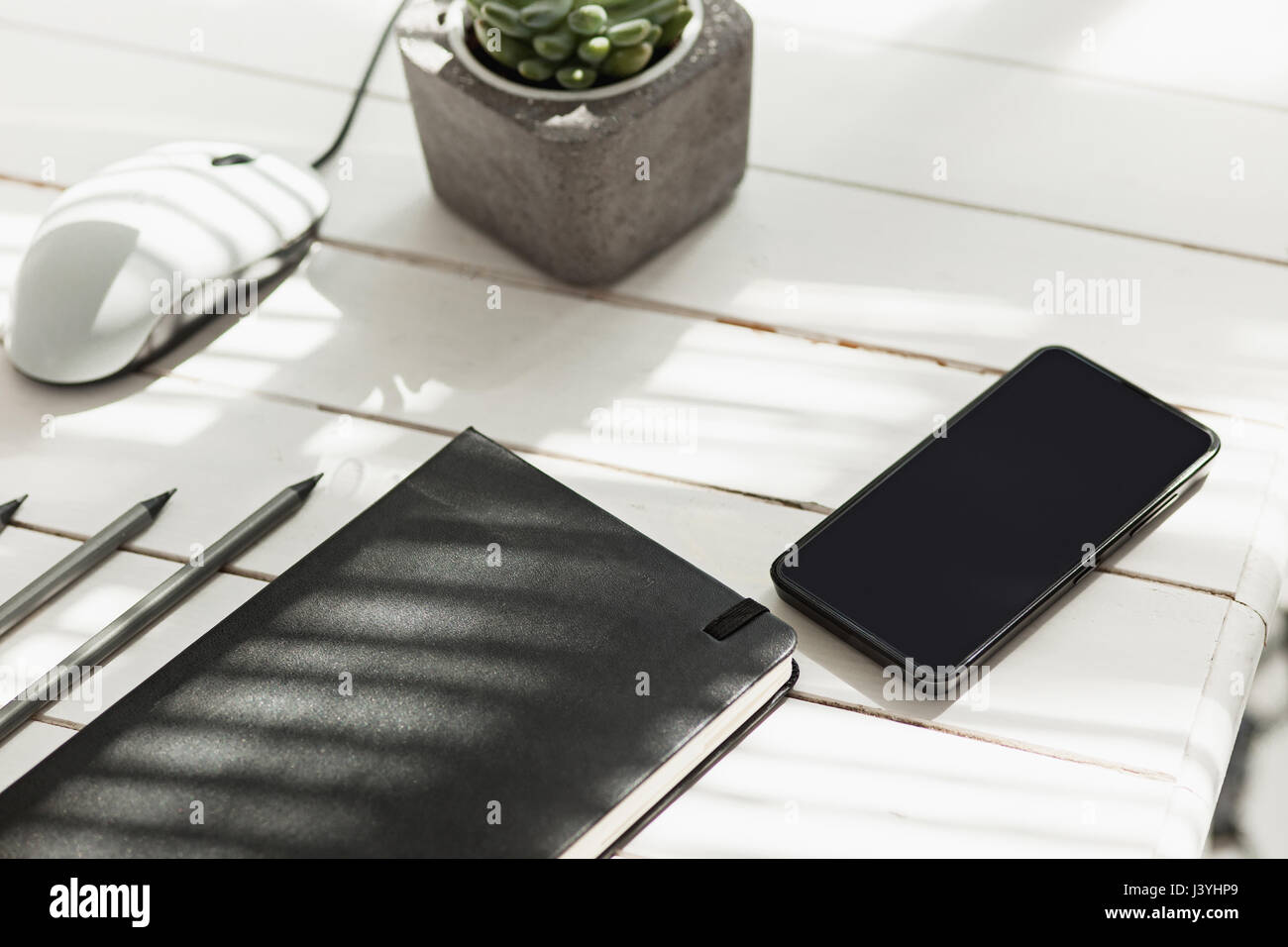 Office desk table with computer, supplies and phone Stock Photo - Alamy