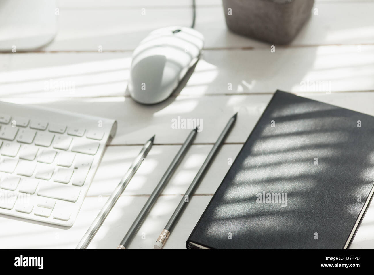 Office desk table with computer, supplies and phone Stock Photo - Alamy