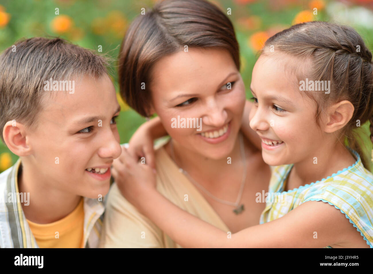 Happy smiling mother with children Stock Photo - Alamy