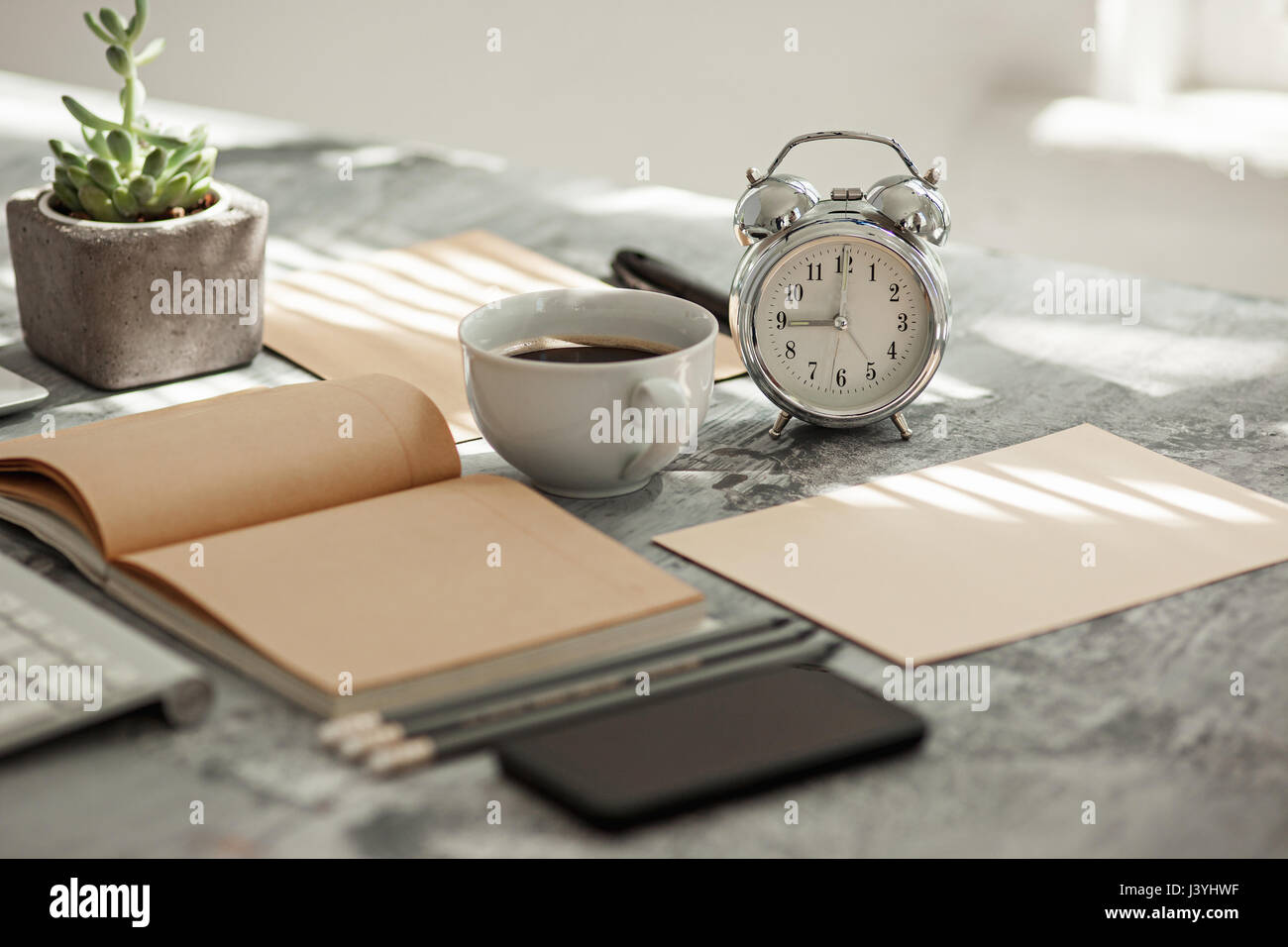 Office desk table with computer, supplies and phone Stock Photo - Alamy