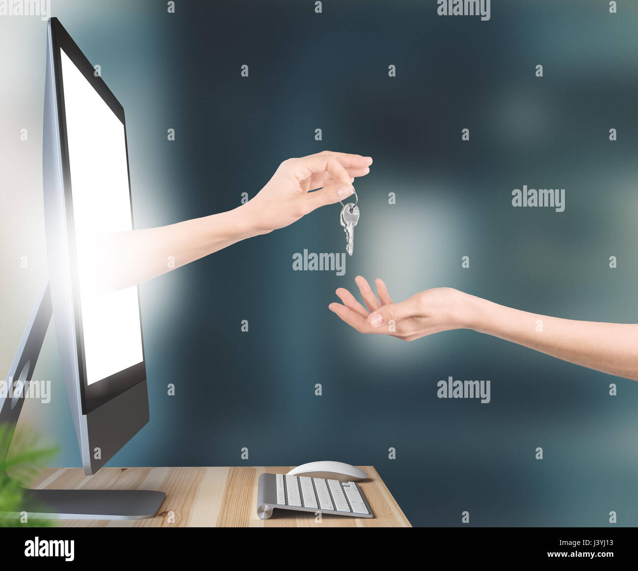 Hands with keys come out of pc monitor Stock Photo - Alamy
