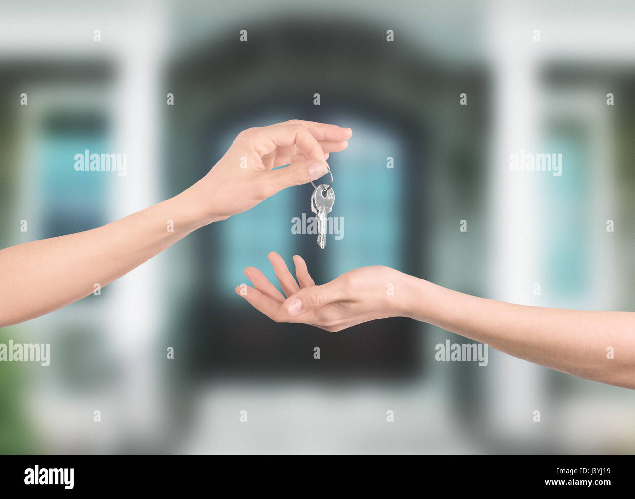 Hands and keys, give keys of new house Stock Photo - Alamy