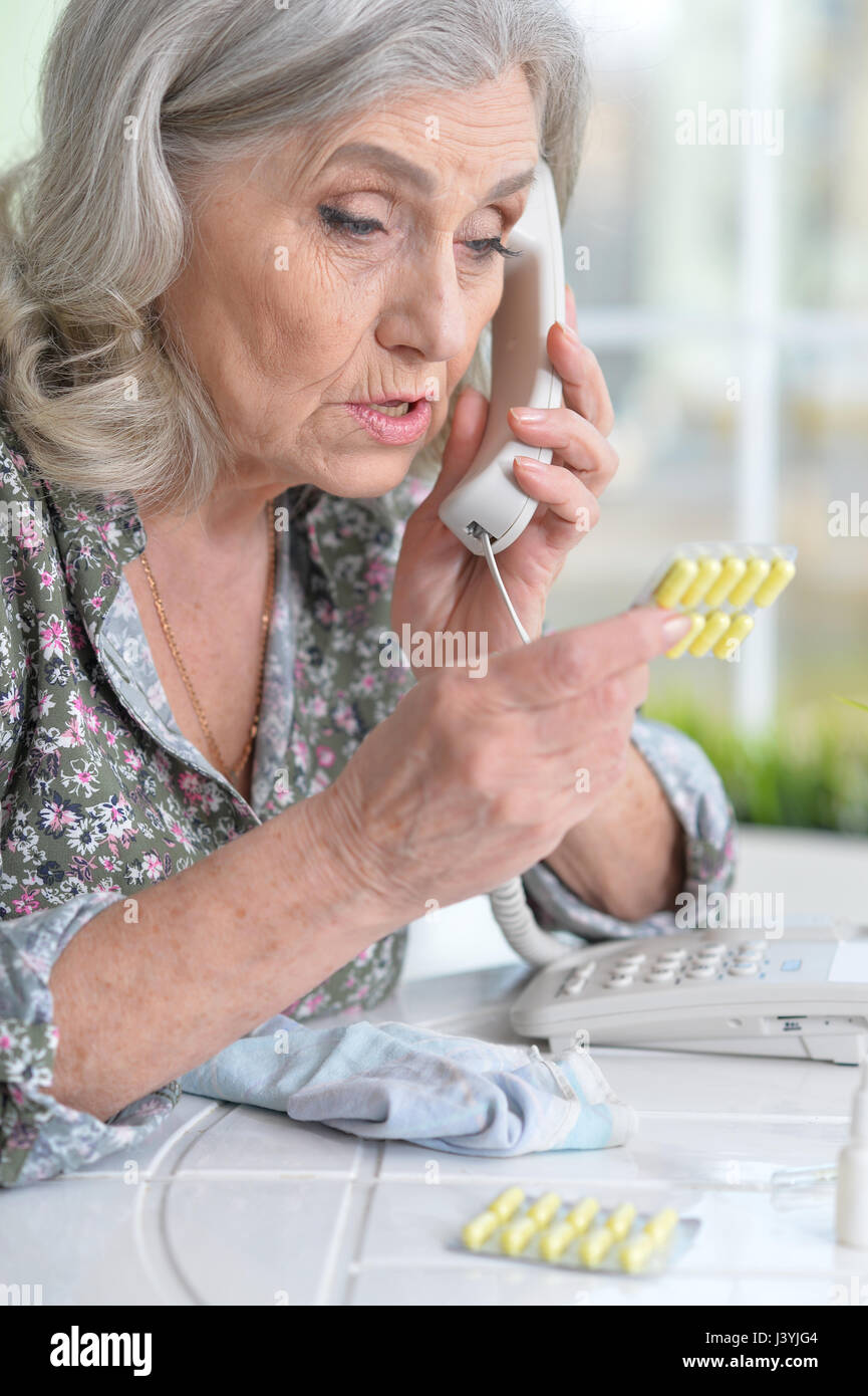 Attractive woman taking medicine pill hi-res stock photography and ...