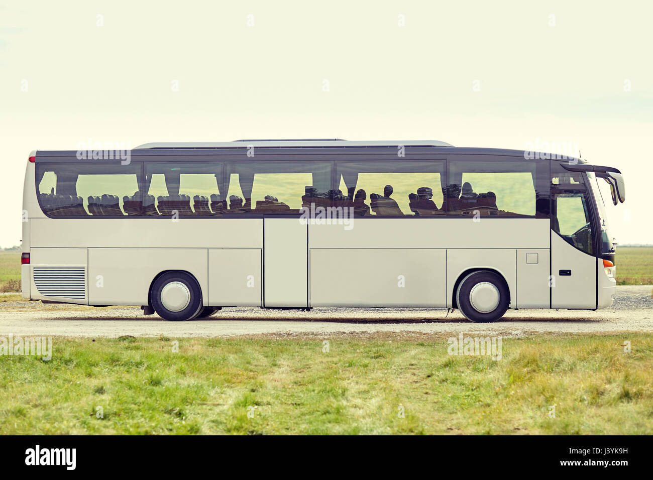 tour bus staying outdoors Stock Photo - Alamy