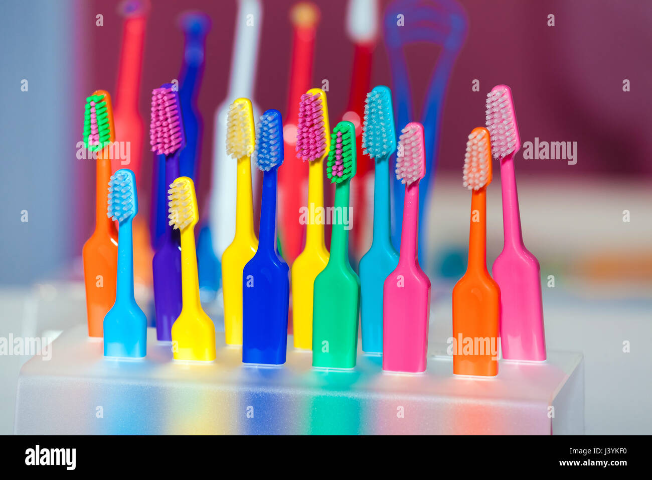 Toothbrushes of different colors Stock Photo - Alamy