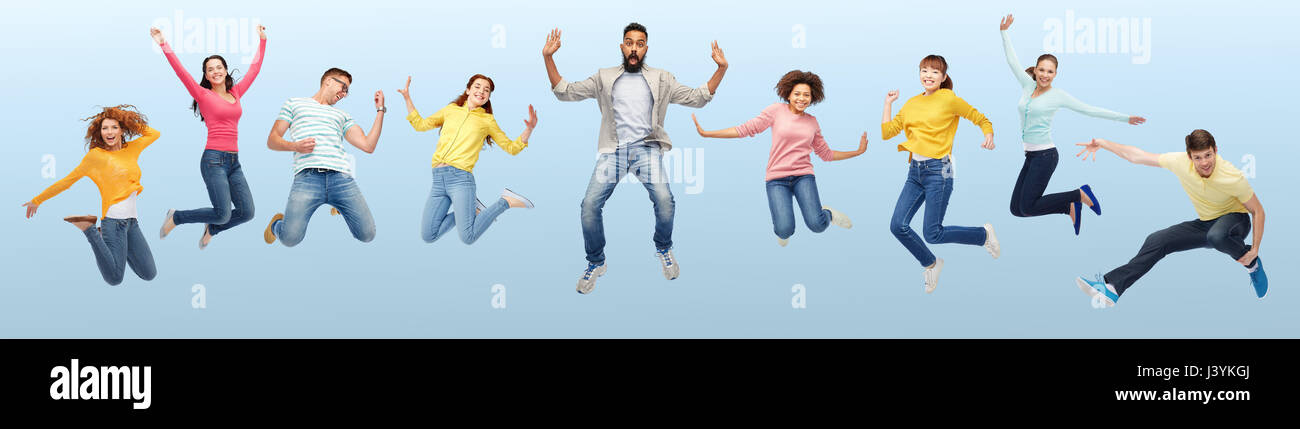 international group of happy people jumping Stock Photo - Alamy