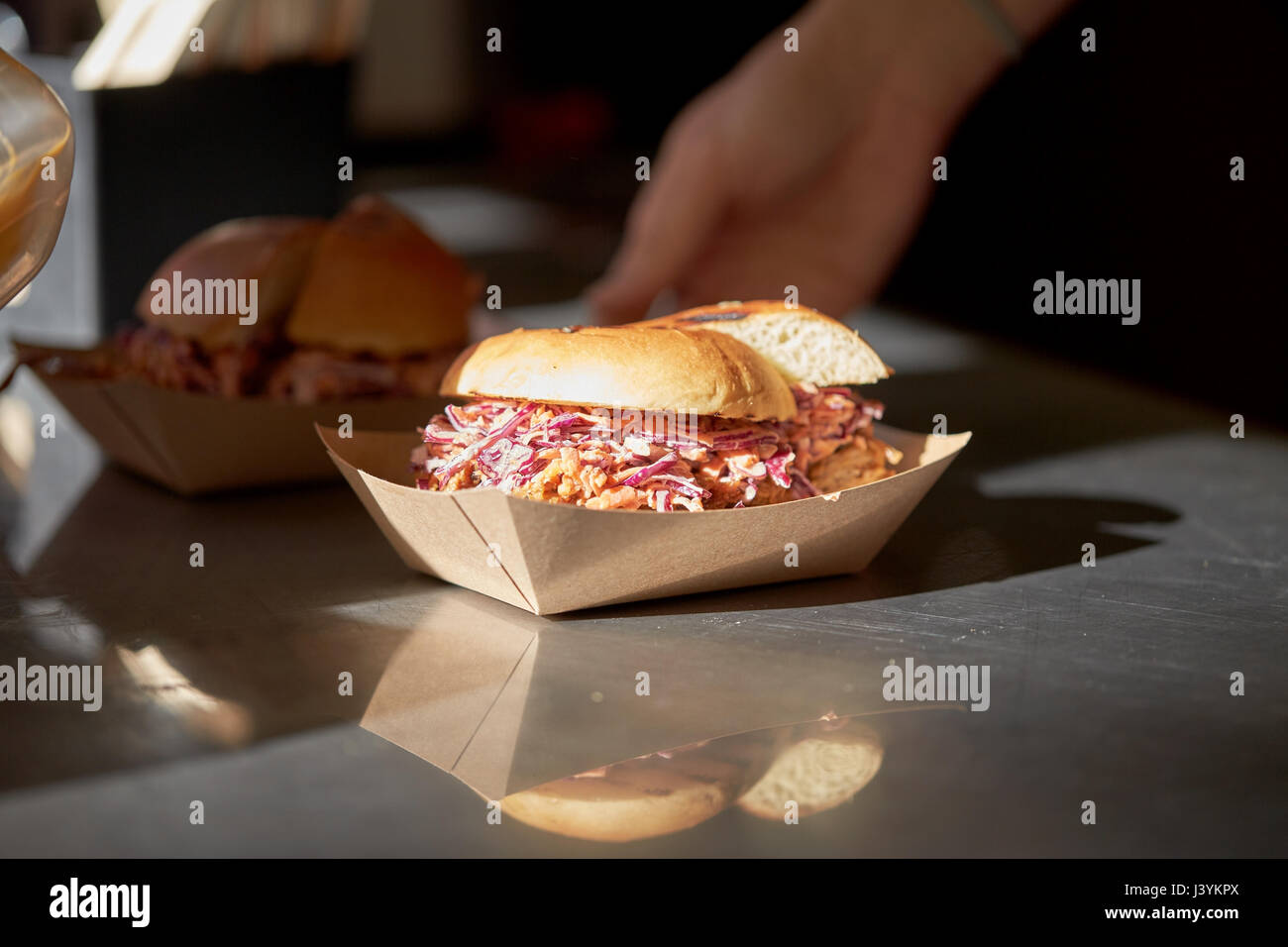 hamburger in disposable paper plate on table Stock Photo - Alamy