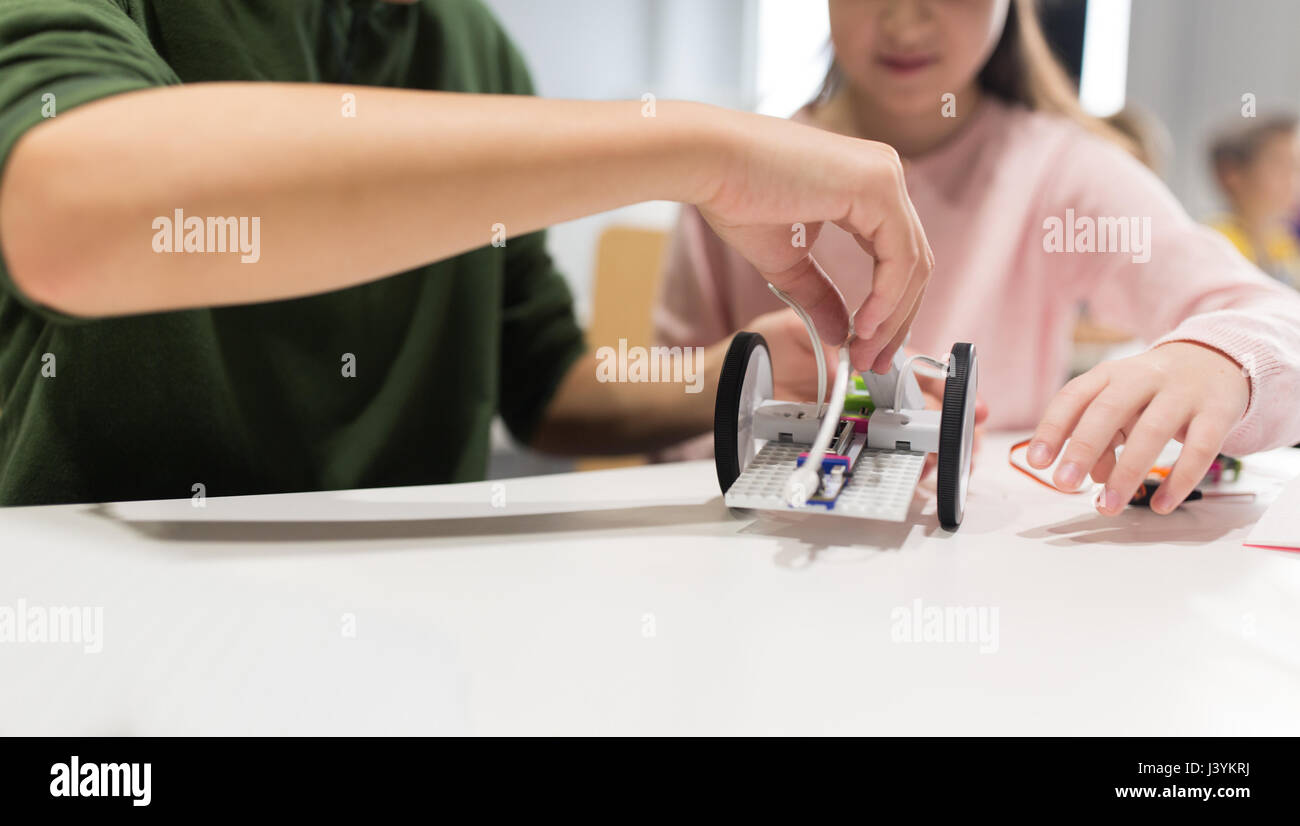 happy children building robots at robotics school Stock Photo - Alamy