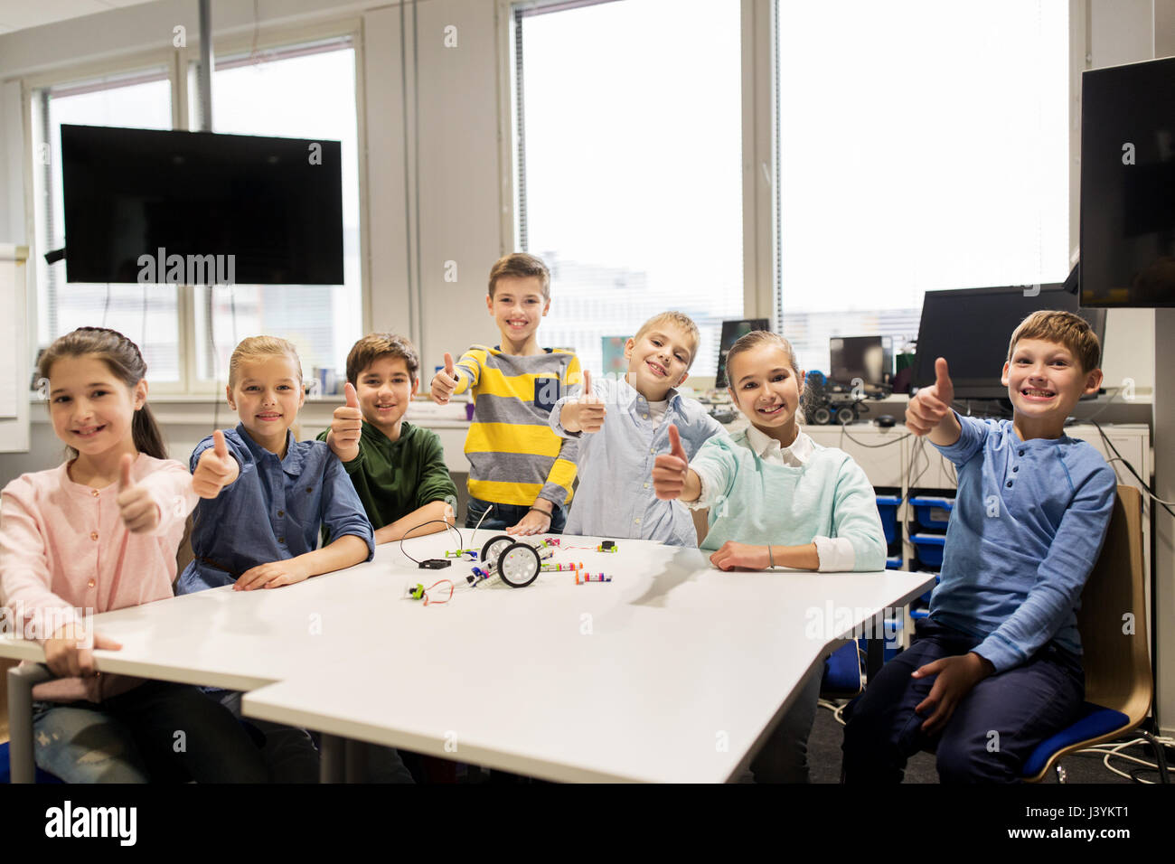 happy children building robots at robotics school Stock Photo - Alamy
