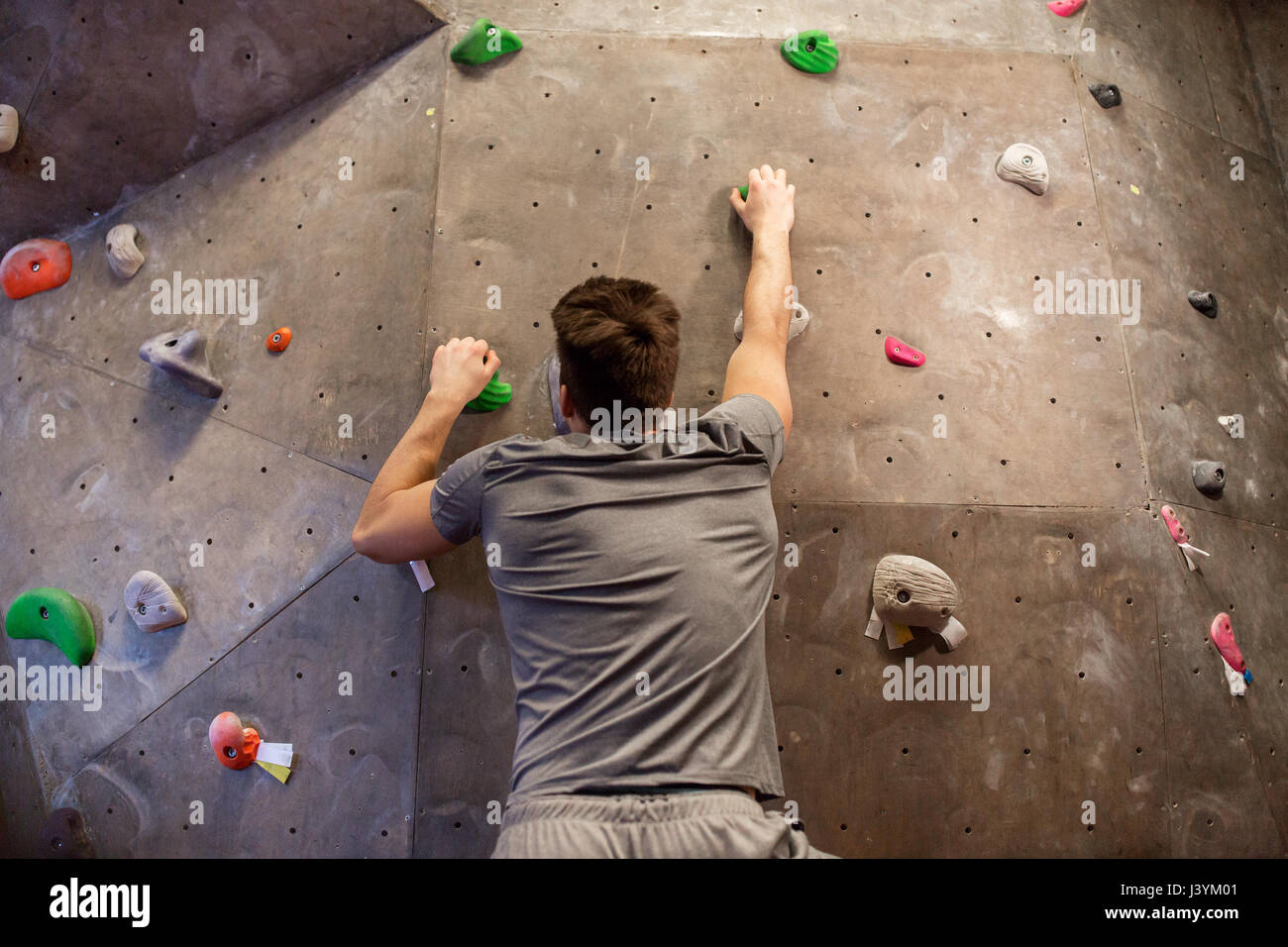 Man indoor rock wall hi-res stock photography and images - Alamy