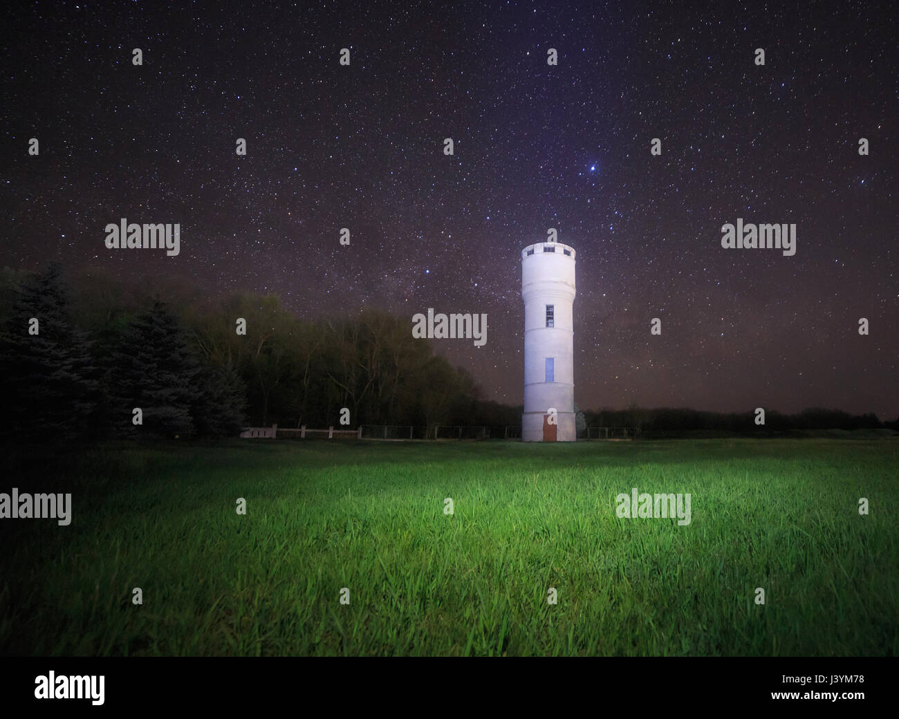 landscape with water tower against night sky Stock Photo - Alamy
