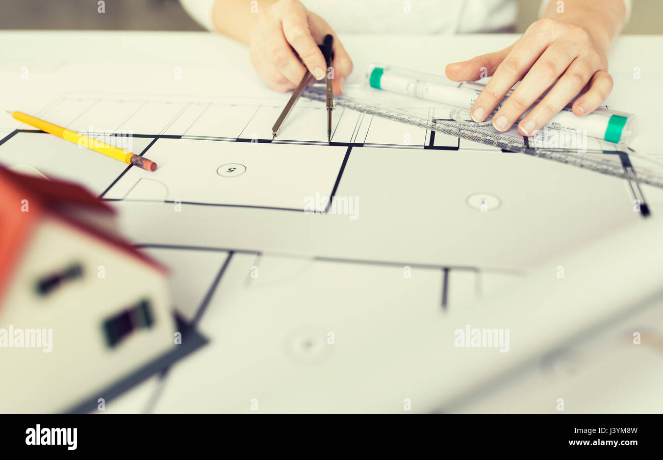 close up of hands with compass measuring blueprint Stock Photo - Alamy