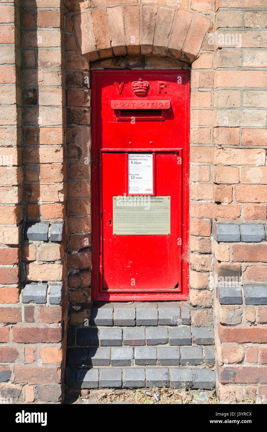 Old wall-mounted Royal Mail post box which has a memorial to Sergeant ...