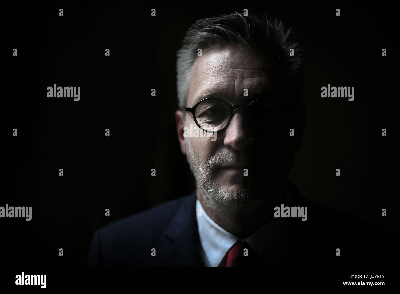 Portrait of an handsome man in the darkness Stock Photo - Alamy