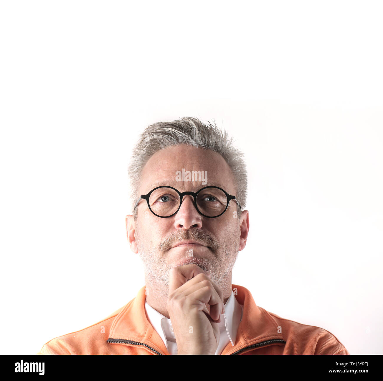 Portrait of an handsome man thinking Stock Photo - Alamy