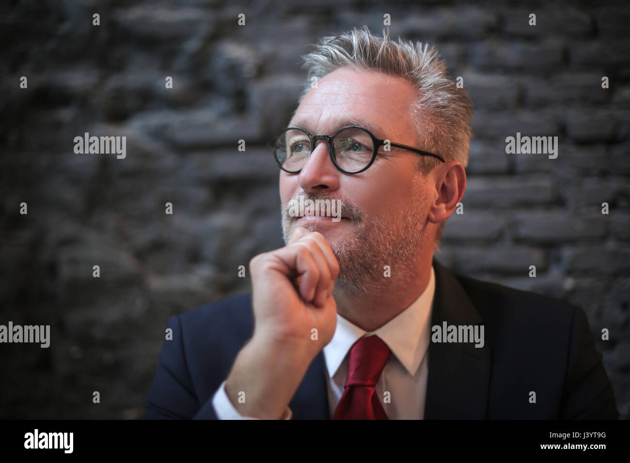 Handsome man thinking at the future Stock Photo - Alamy