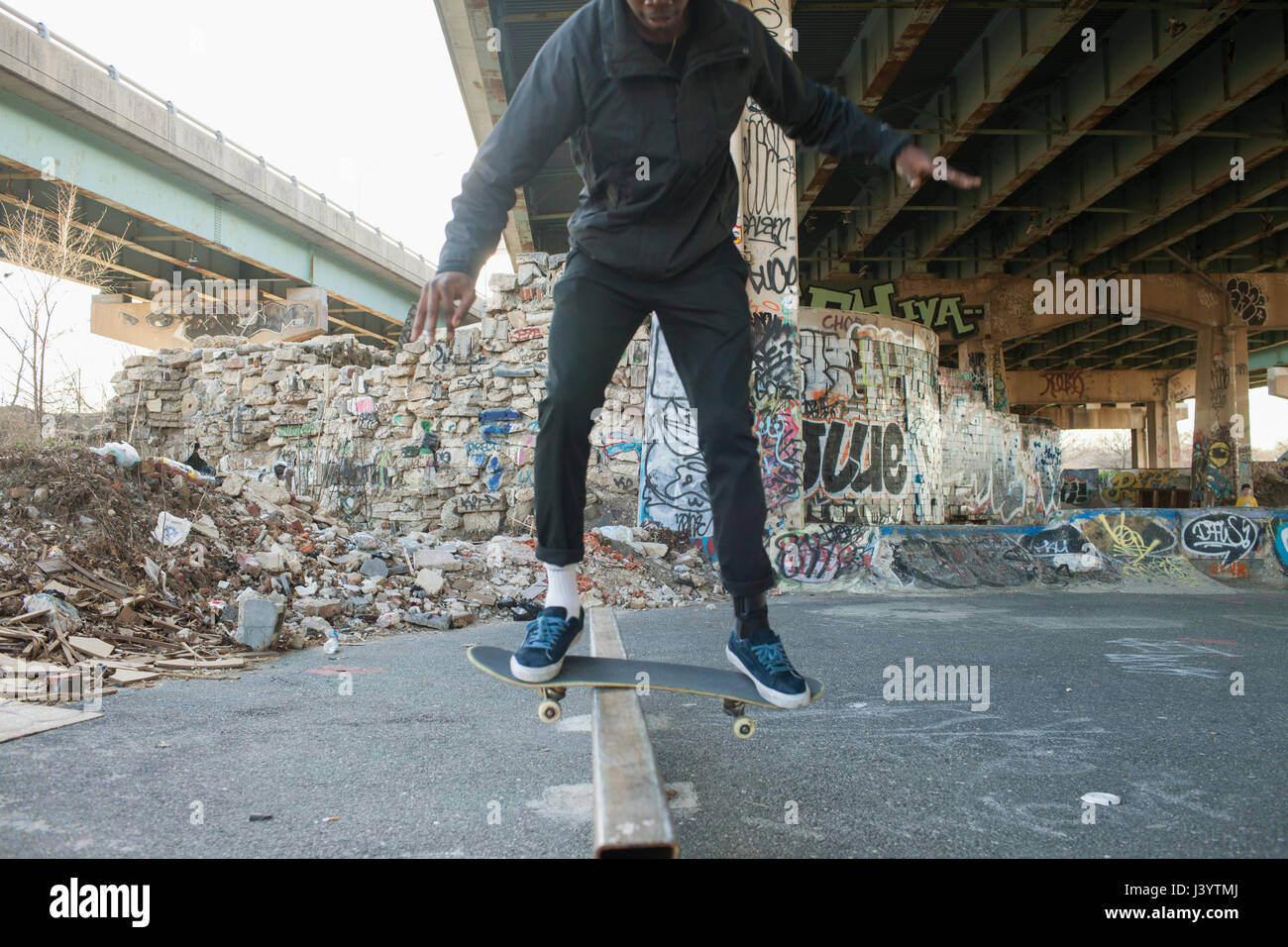 A young man skateboarding Stock Photo - Alamy