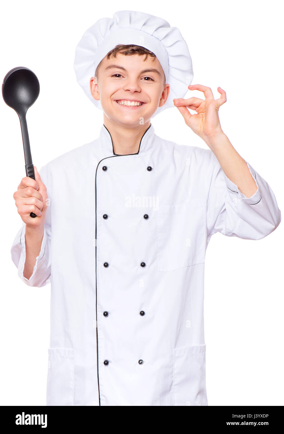 Teen boy wearing chef uniform Stock Photo - Alamy