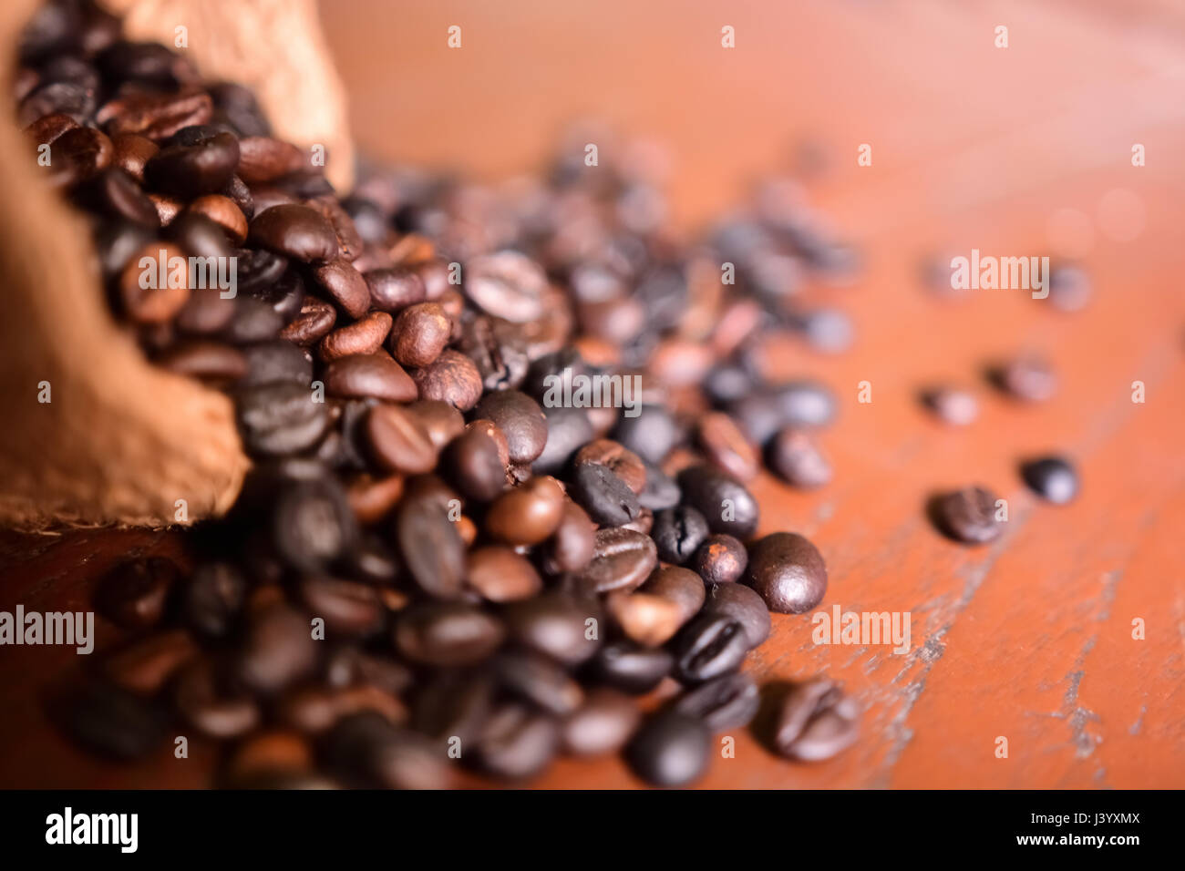 Pouring coffee beans Stock Photo - Alamy