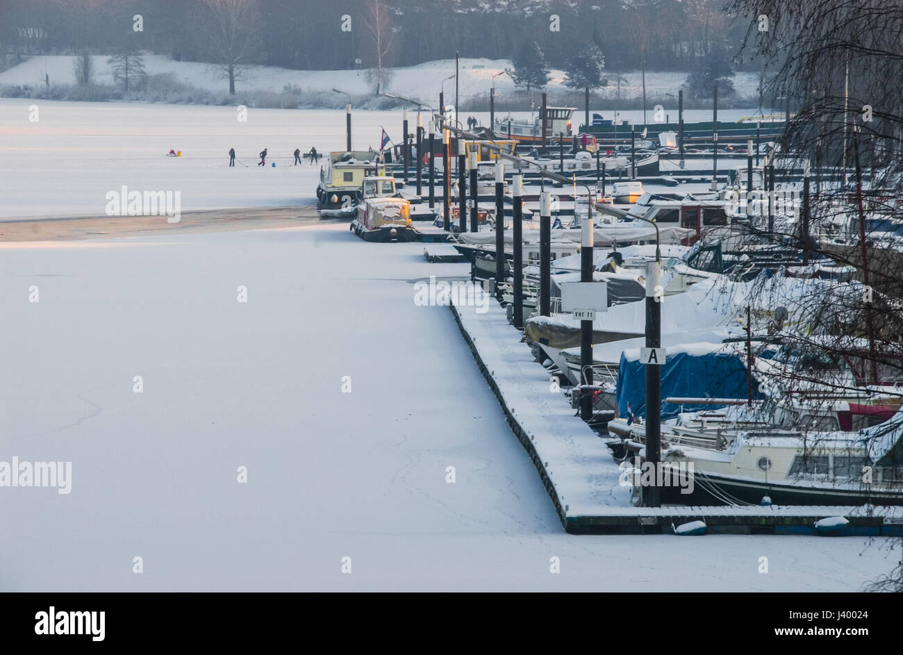 Frozen up harbor port icebound boats ships winter snow Stock Photo - Alamy