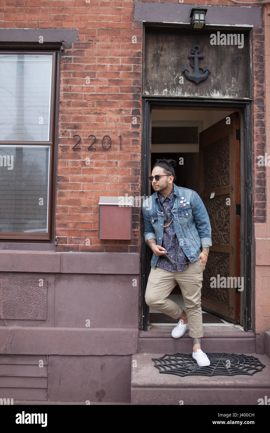 A young man on a doorstep Stock Photo - Alamy