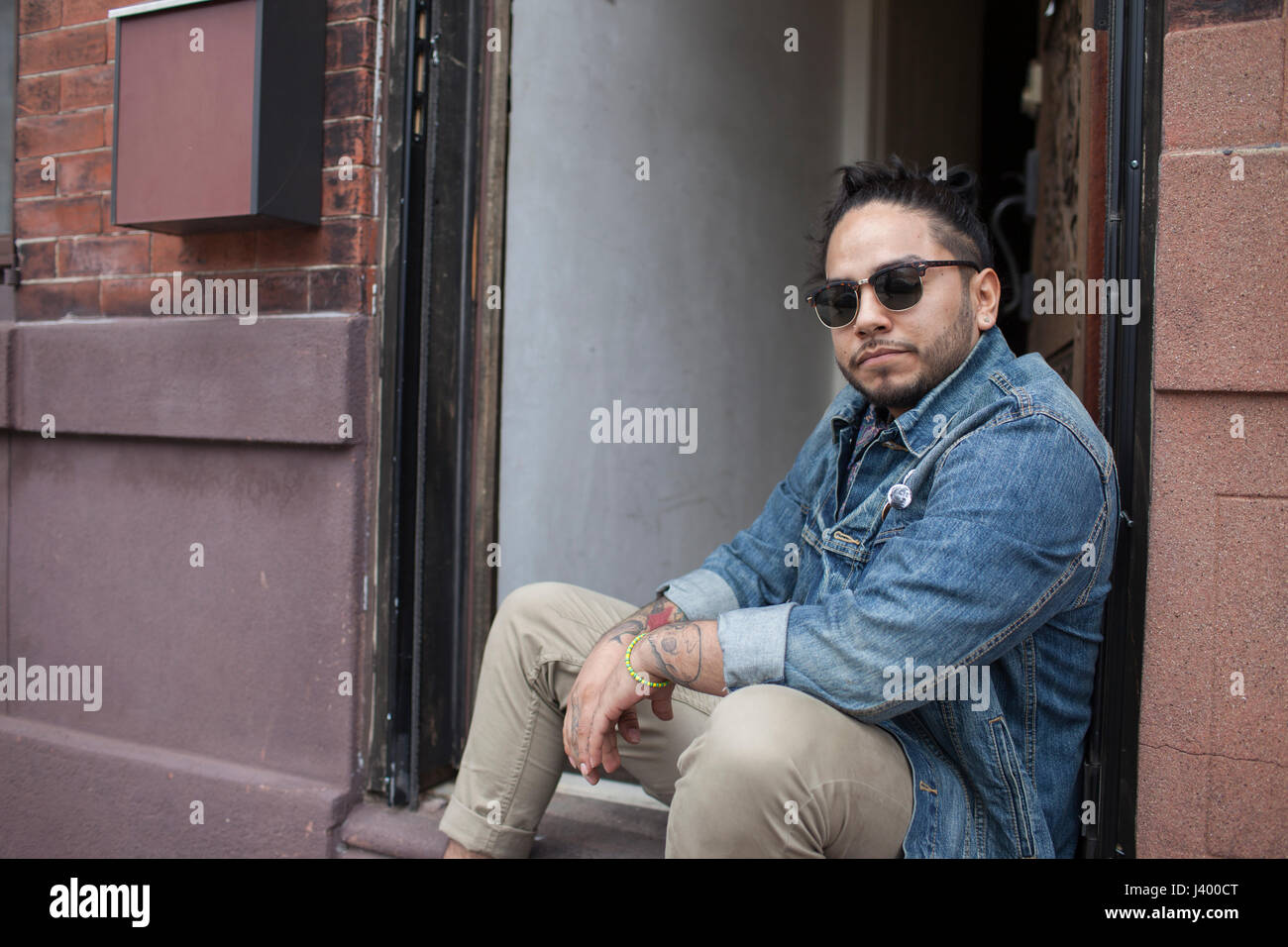 A young man on a doorstep Stock Photo - Alamy