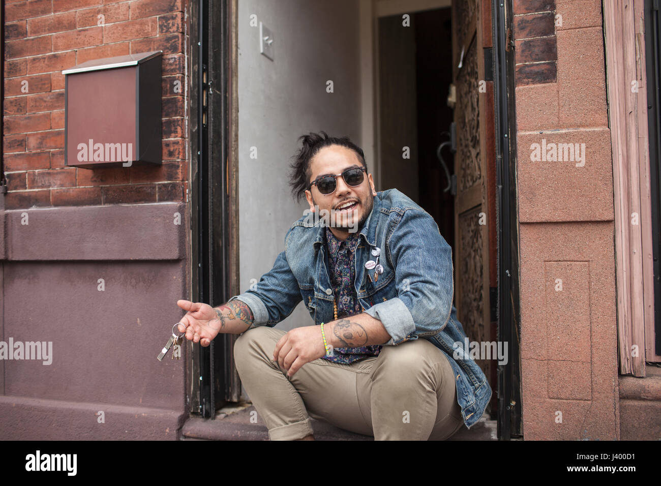 A young man on a doorstep Stock Photo - Alamy