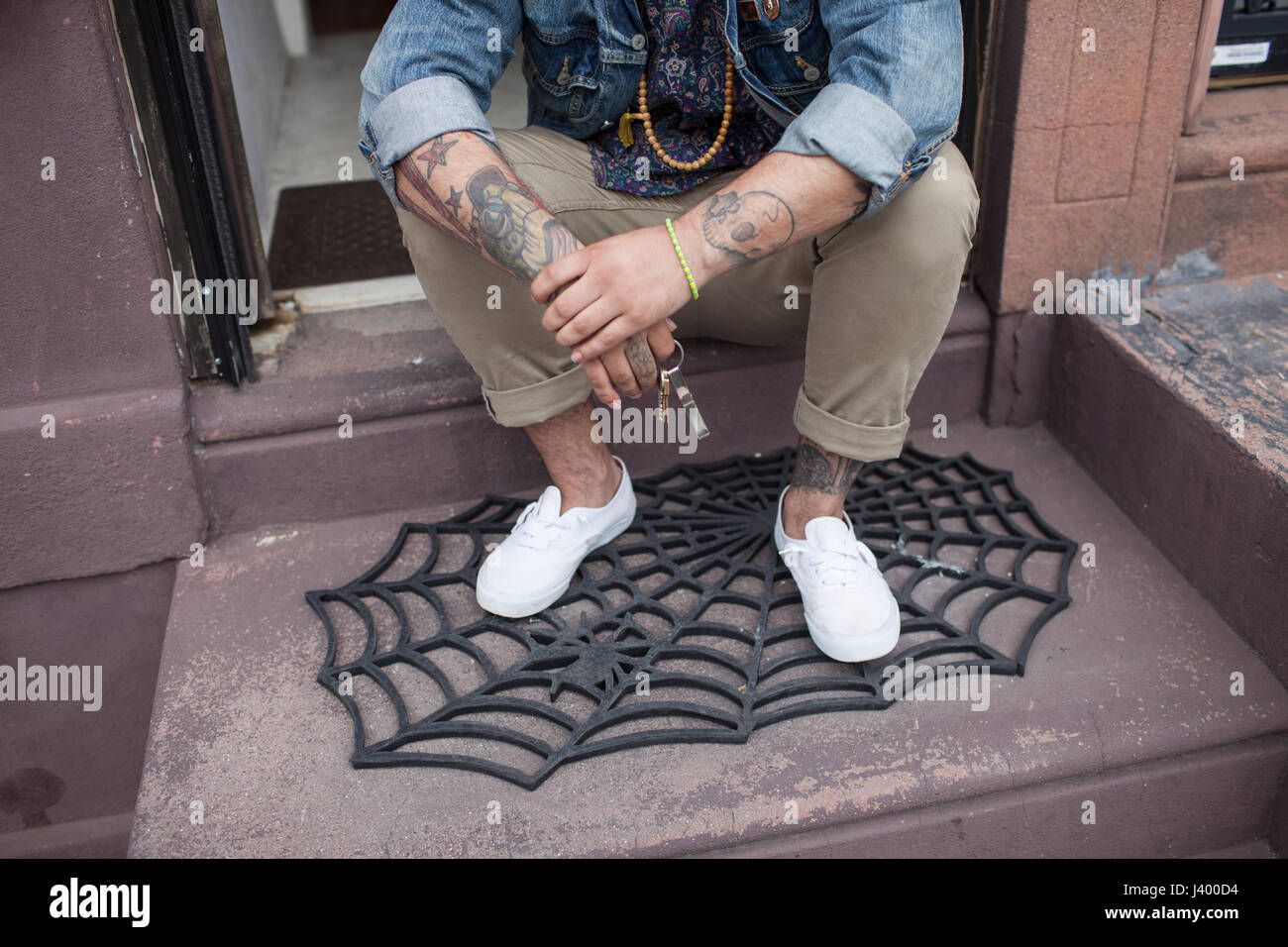 A young man on a doorstep Stock Photo - Alamy