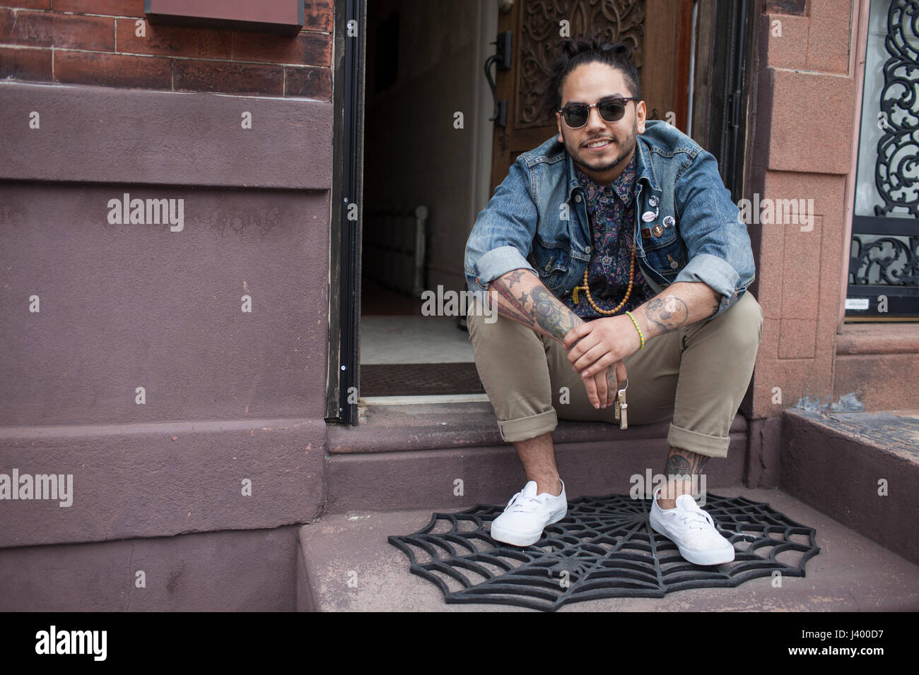 A young man on a doorstep Stock Photo - Alamy