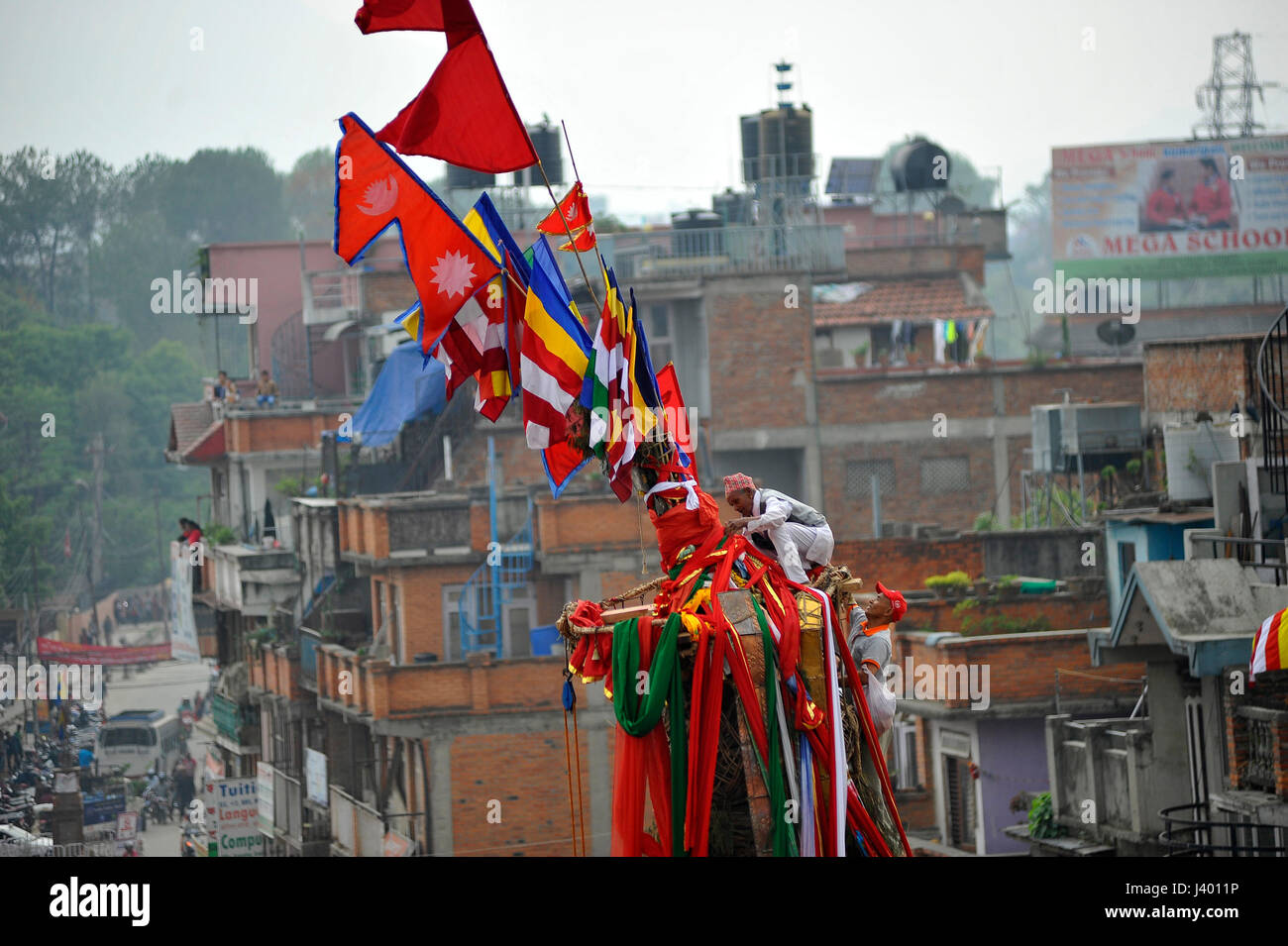 As a ceremony of Rato Machindranath Festival, coconut thrown from top ...