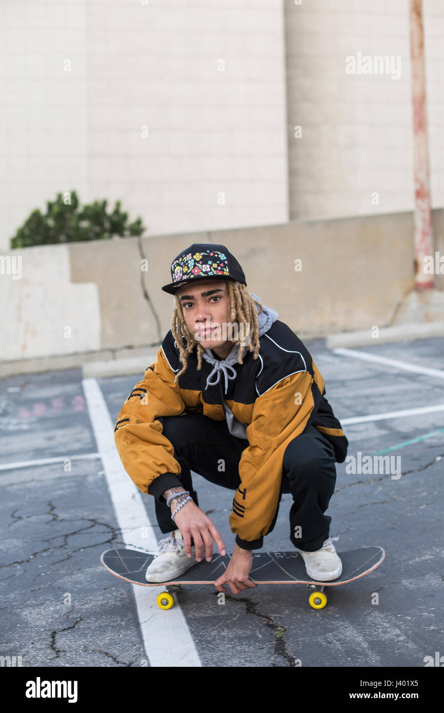 Young man skateboarding Stock Photo - Alamy