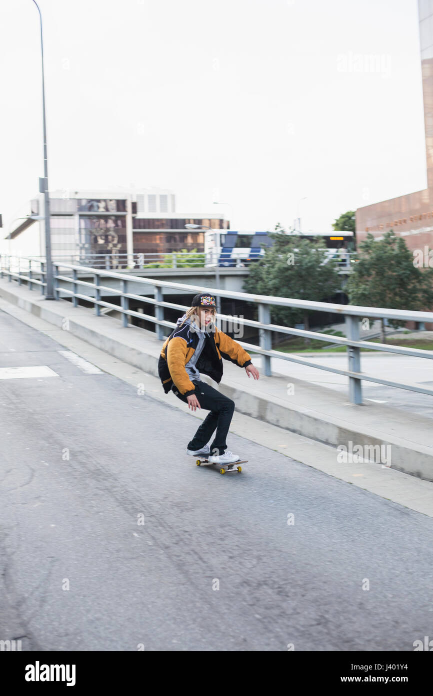 Young man skateboarding Stock Photo - Alamy