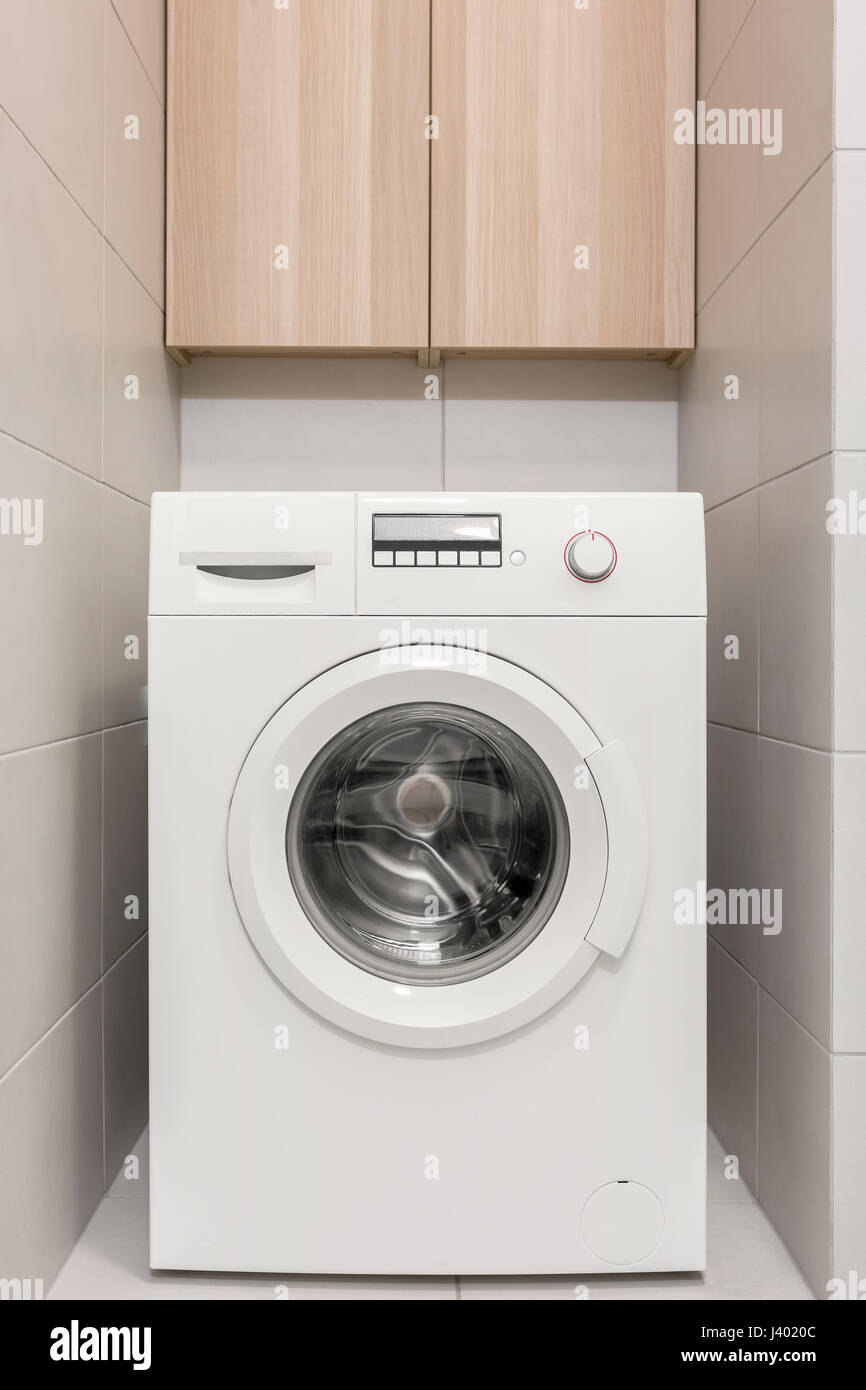 Space washing machine wooden cabinet hi-res stock photography and ...
