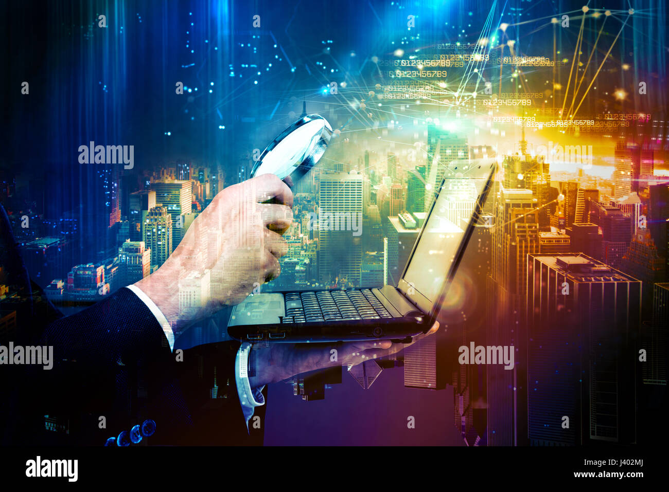 Examine a computer with magnifying glass Stock Photo - Alamy