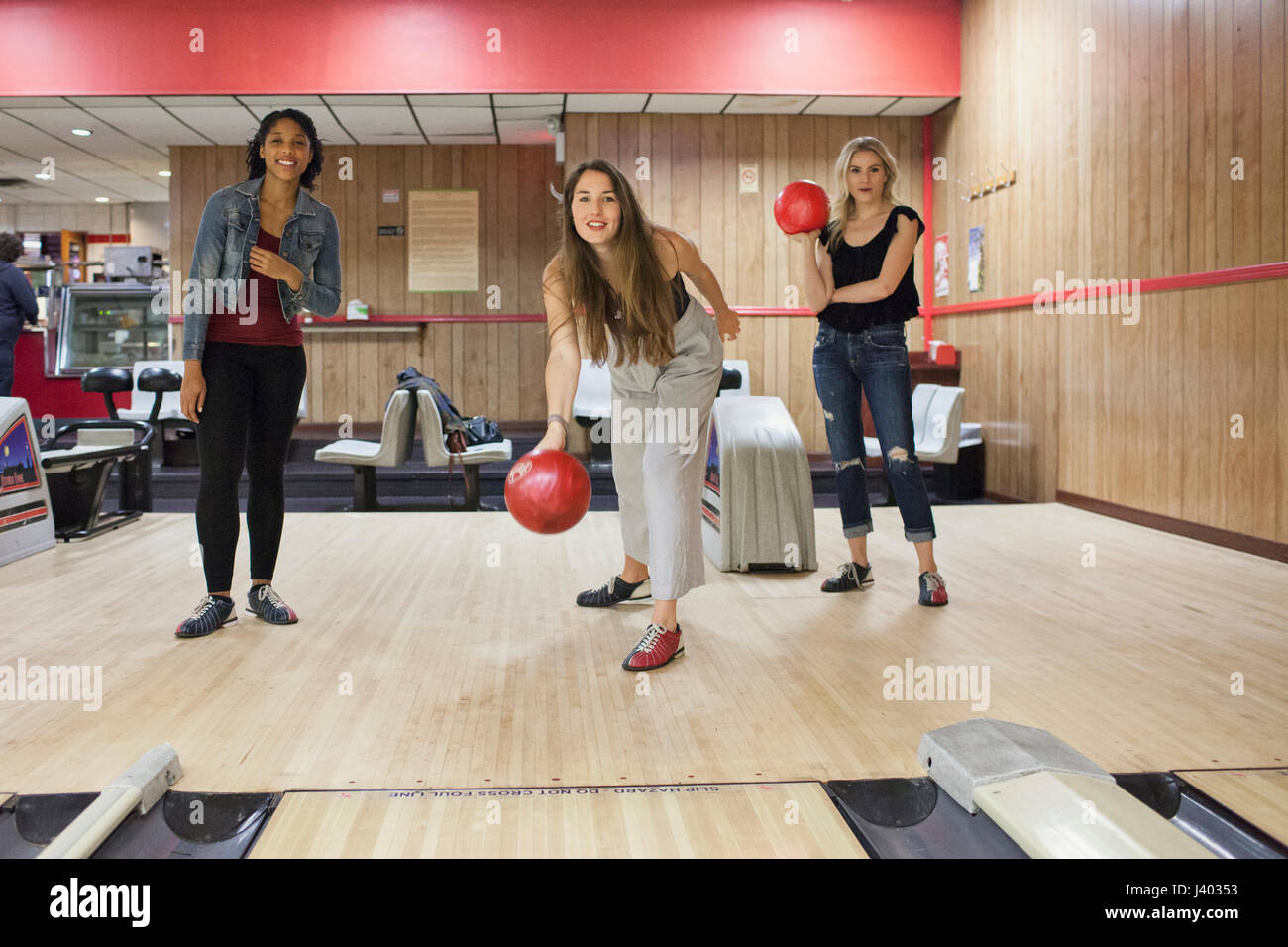 A young women bowling with friends Stock Photo - Alamy