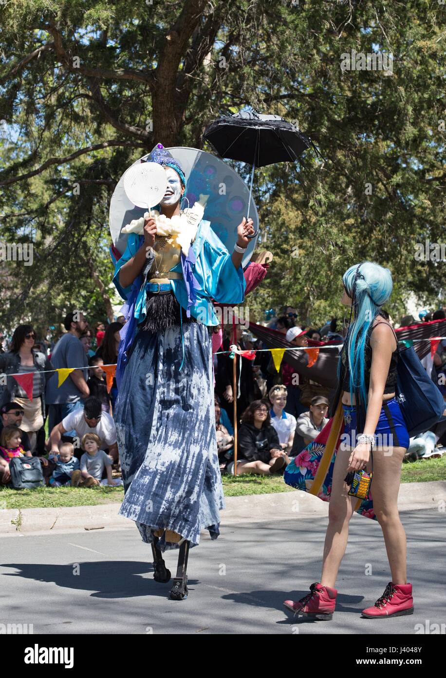 People in costume and on stilts at the Mayday parade in Minneapolis ...