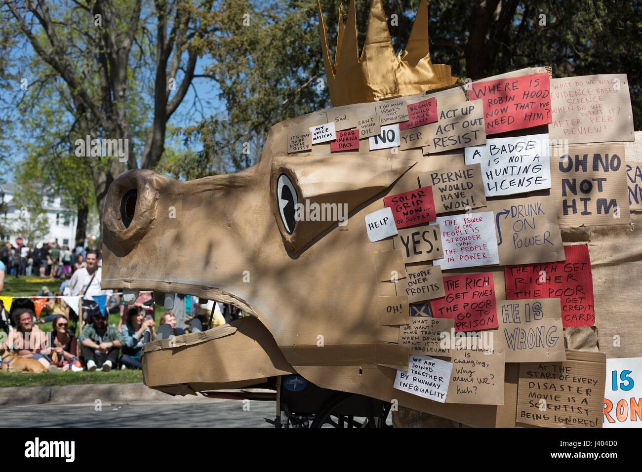 A float covered in protest signs at the Mayday parade in Minneapolis ...