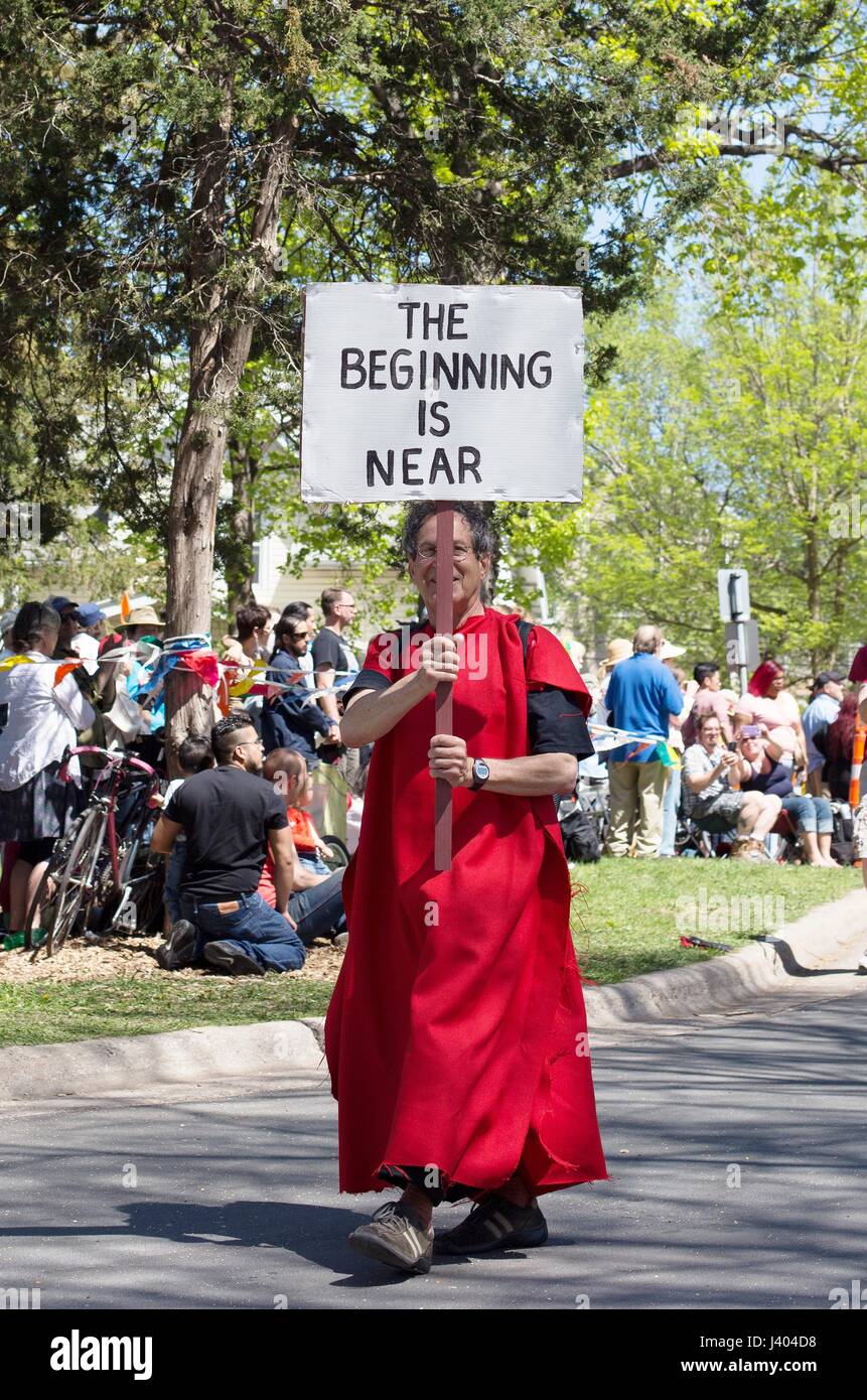 A man carrying a sign that reads "The Beginning is Near" at the Mayday ...