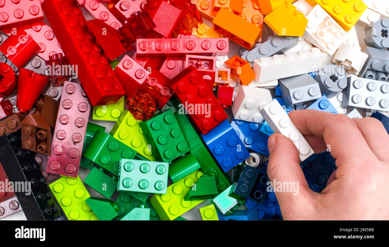closeup of child's hand holding lego web banner Stock Photo - Alamy