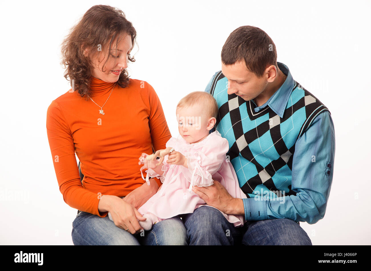 Parents with small daughter on a white background Stock Photo - Alamy