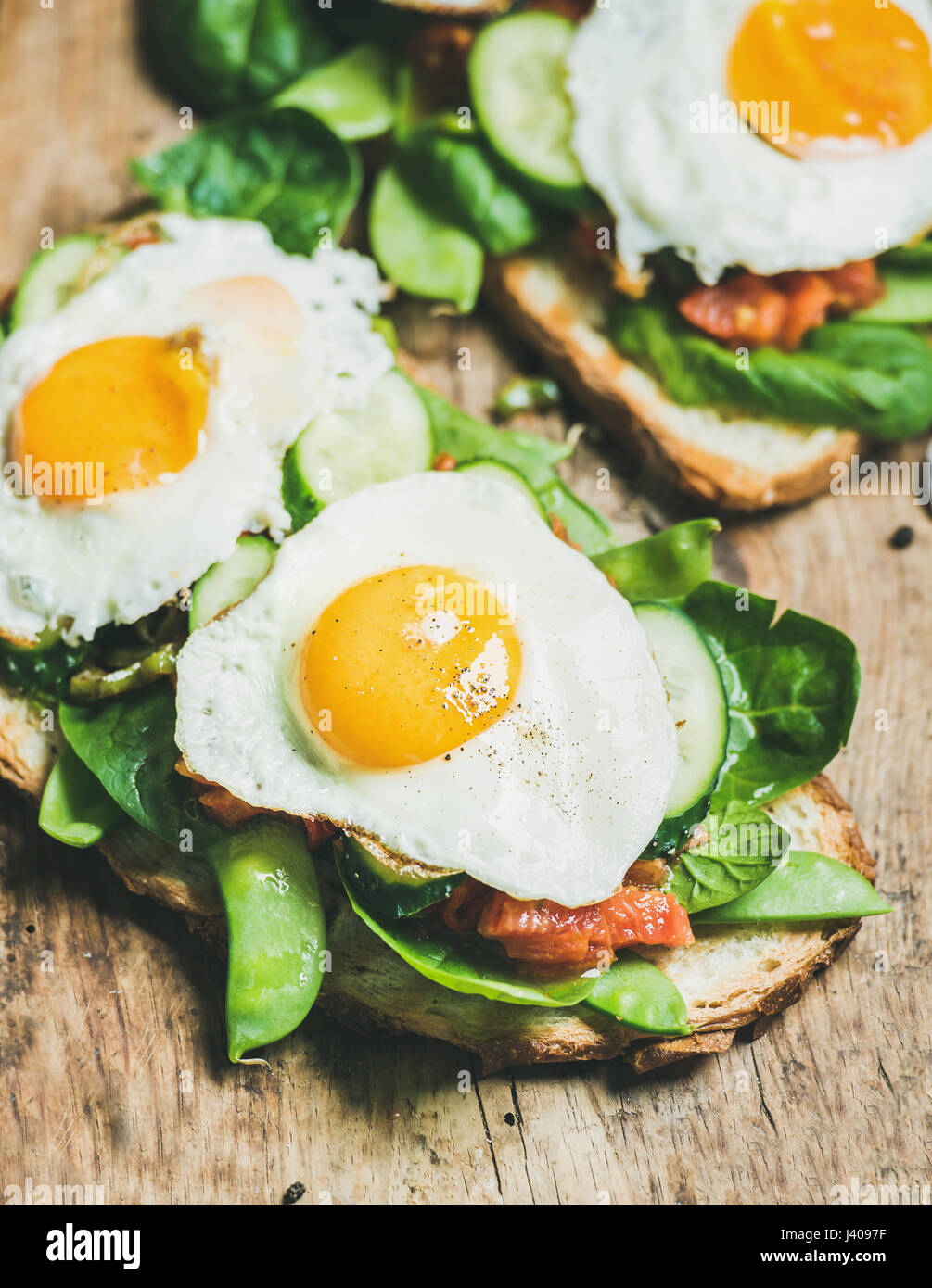 Healthy breakfast sandwiches on wooden board background Stock Photo - Alamy