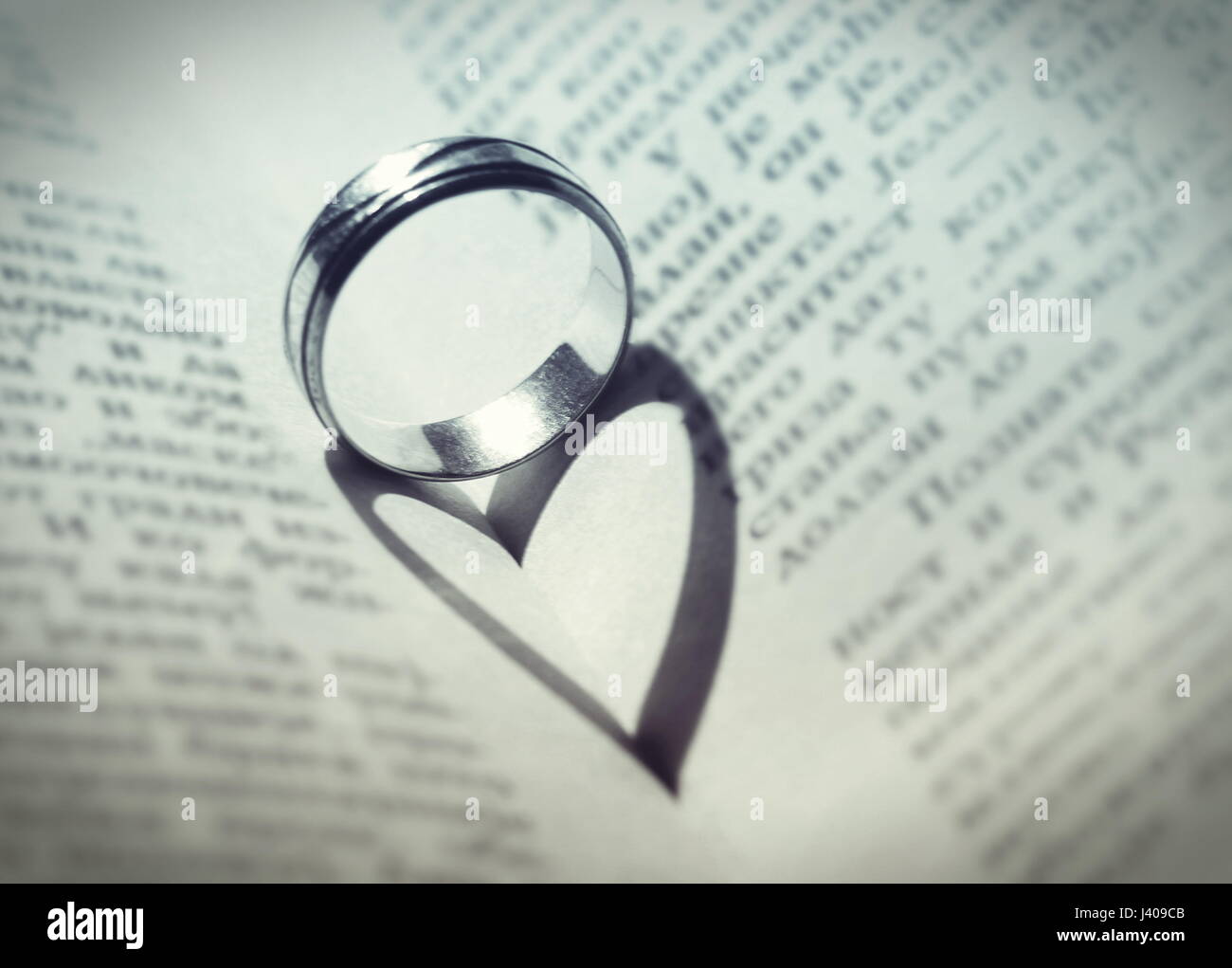 Ring with a shadow shape heart Stock Photo - Alamy