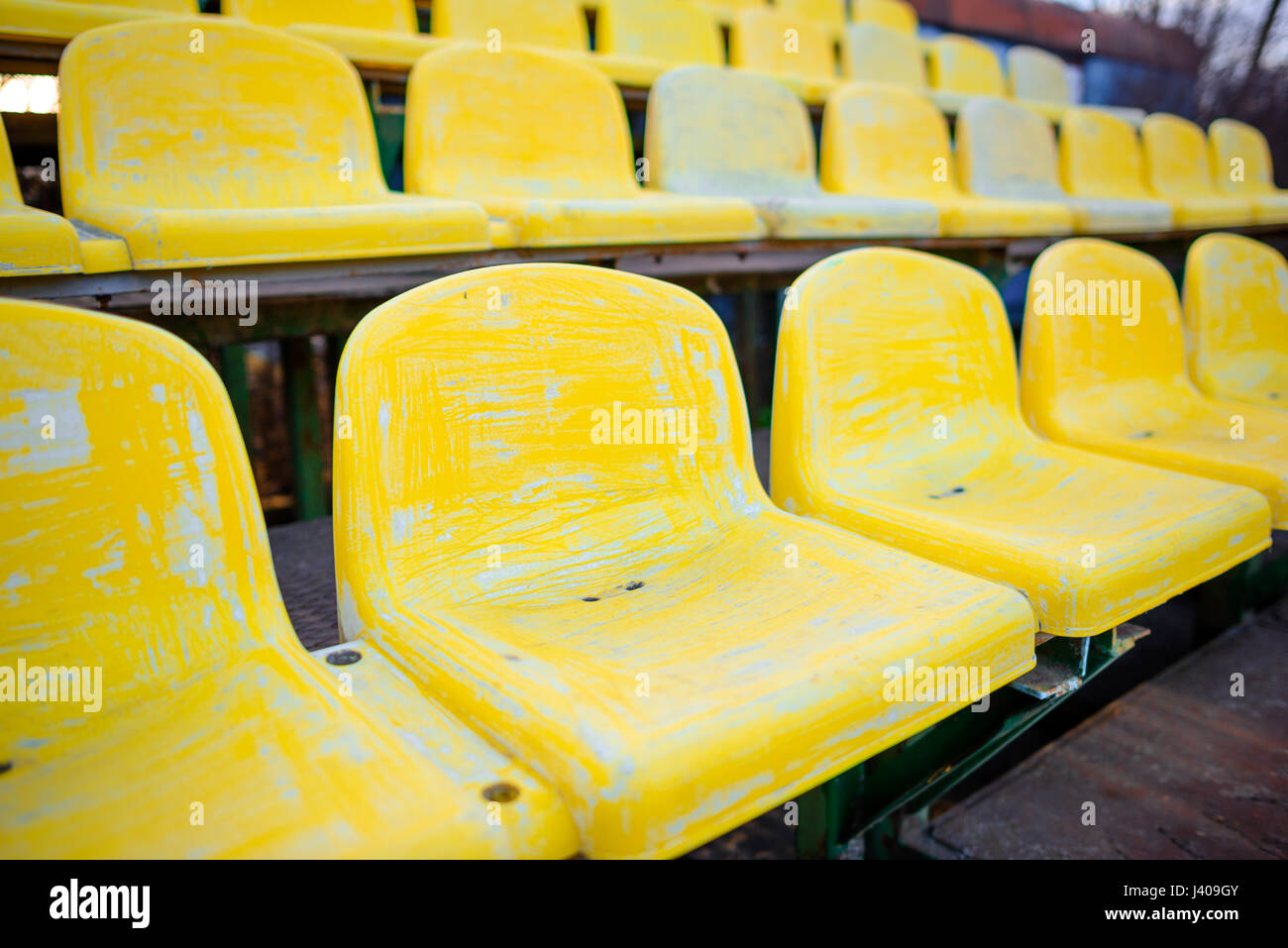 old yellow seat in stadium closeup, background Stock Photo - Alamy